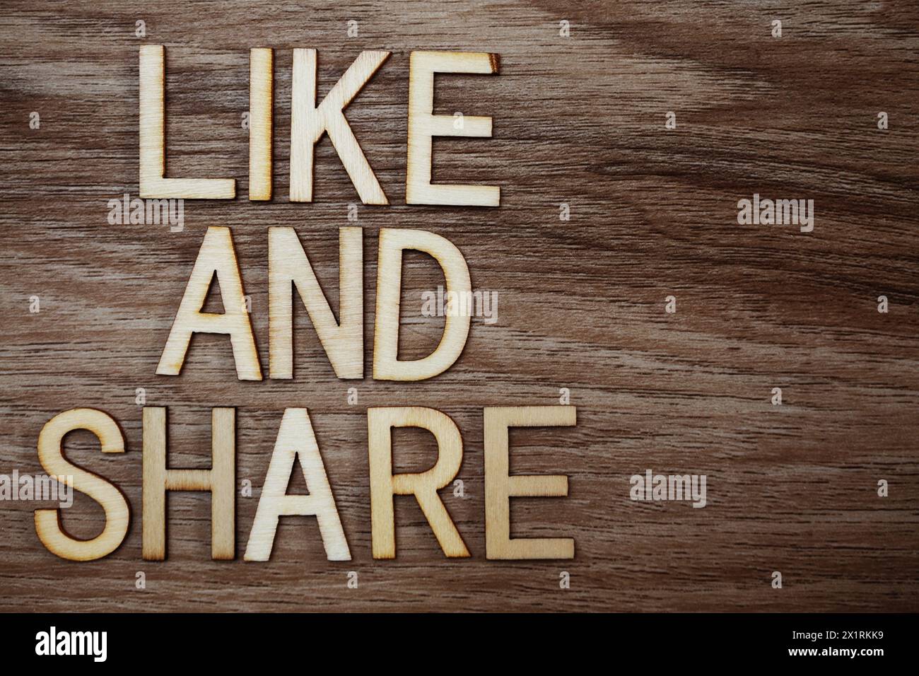 Like and Share alphabet letters on wooden background business concept ...