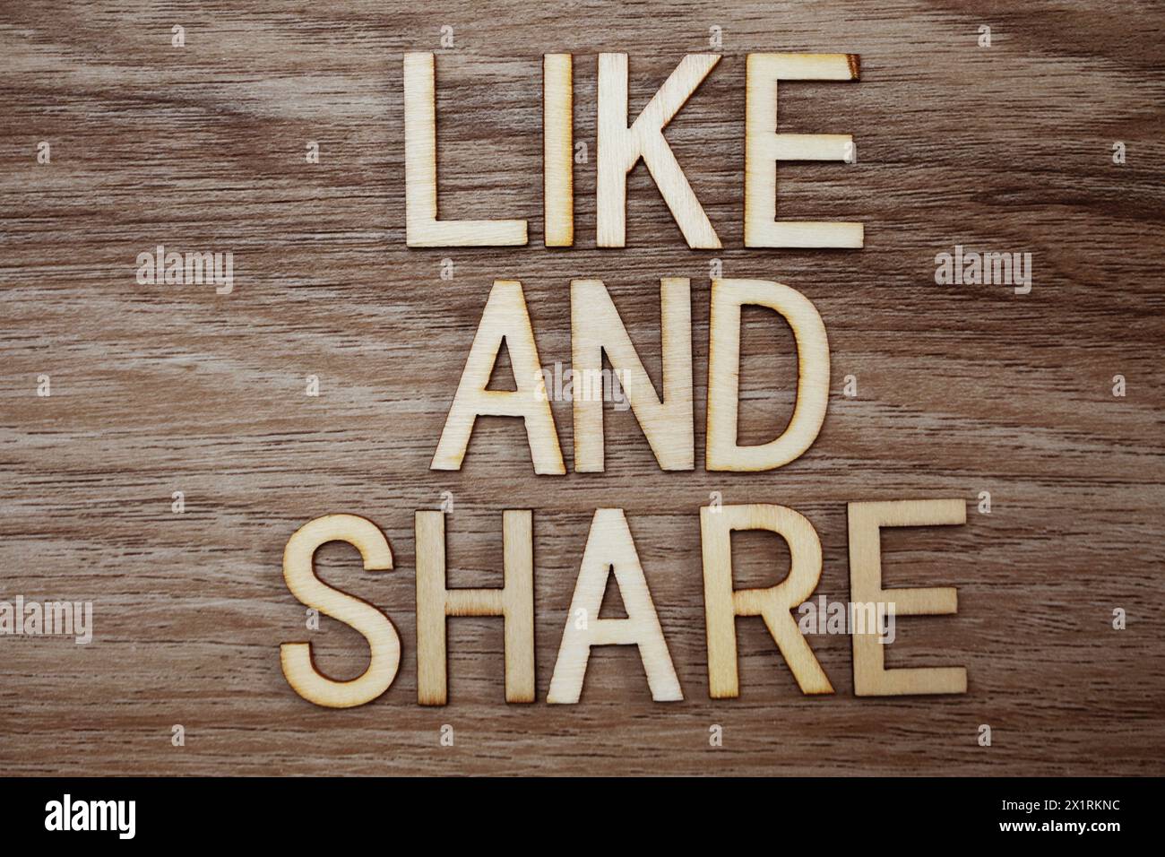 Like and Share alphabet letters on wooden background business concept ...