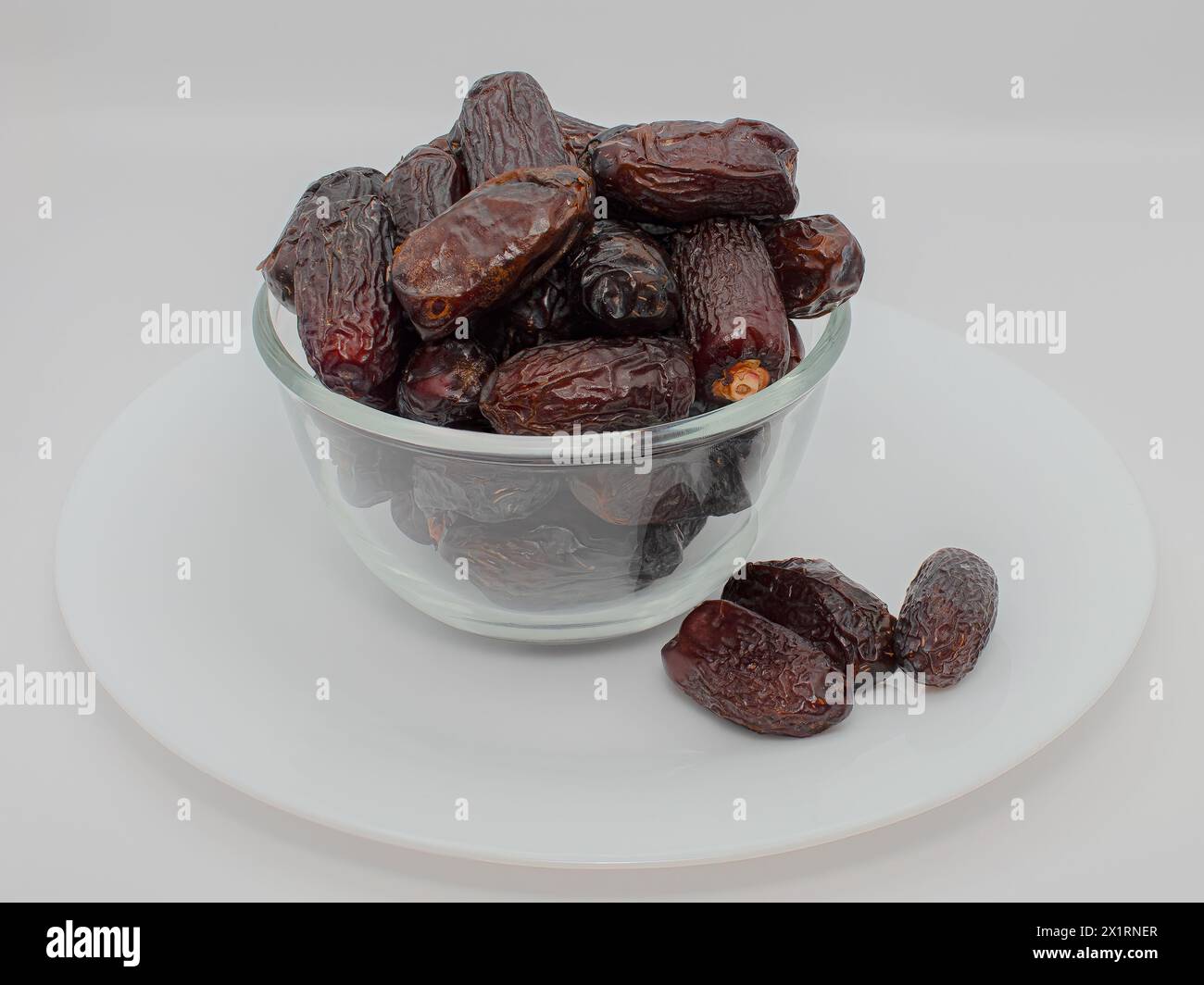 safawi dates in the glass bowl with white background Safawi dates are ...