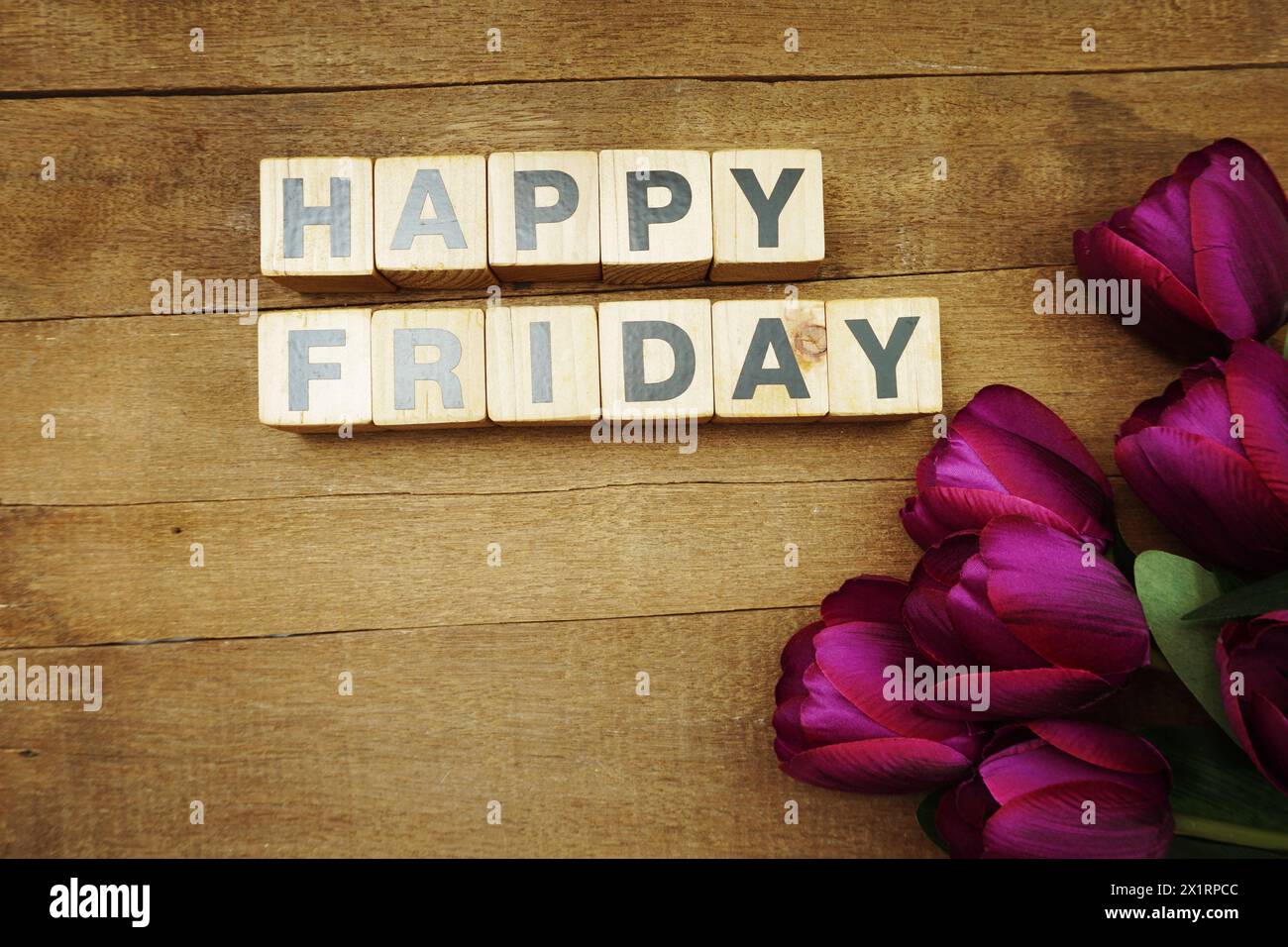 Happy Friday alphabet letter with tulip flower on wooden background ...