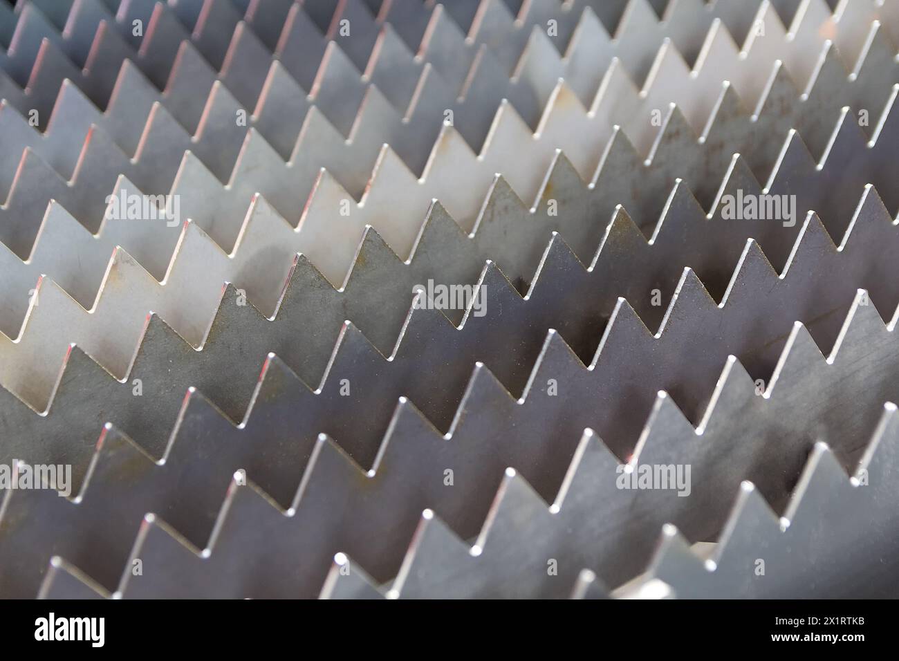 Metal elements in the form of triangles close-up. Backgrounds and ...