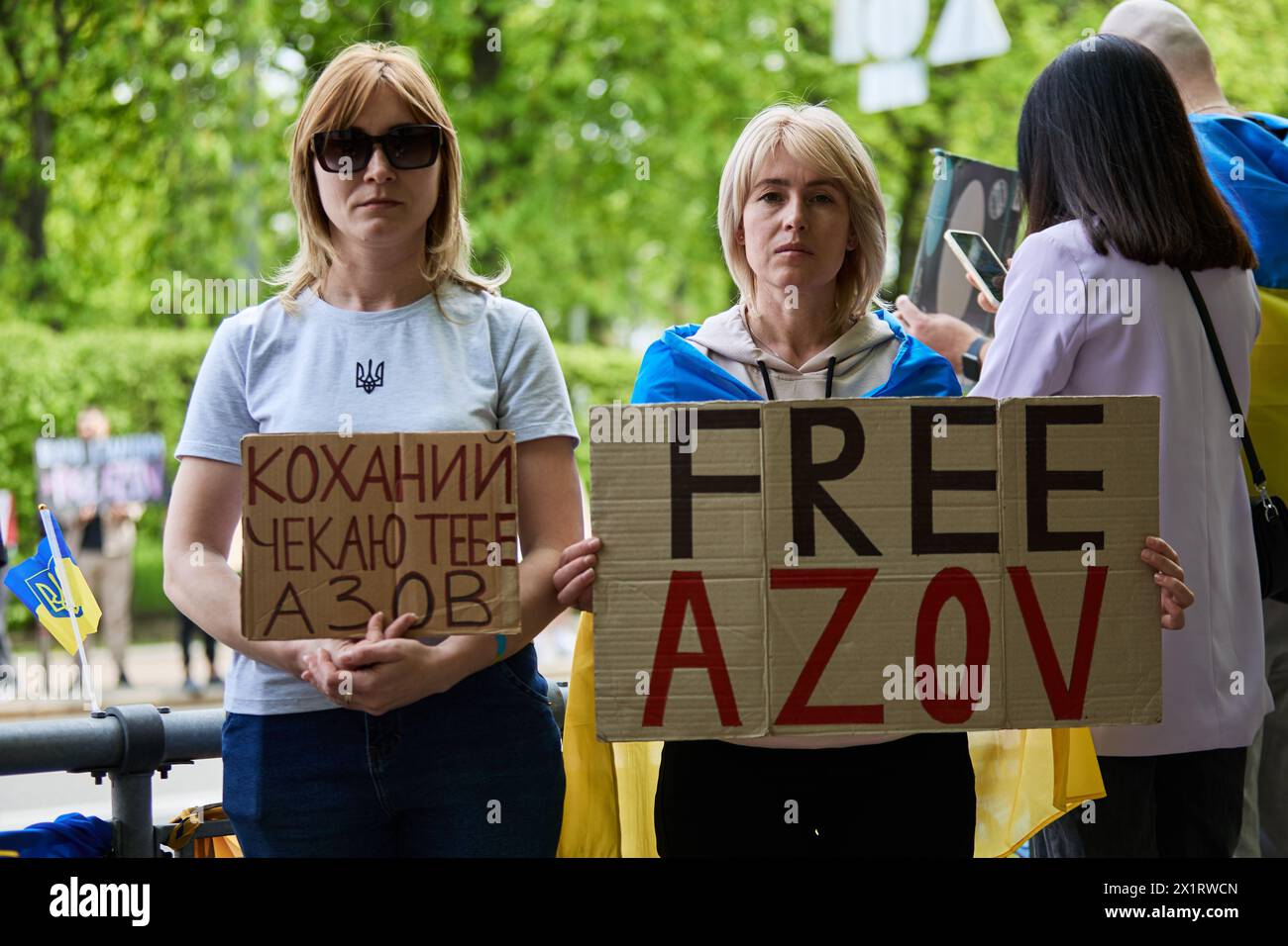Ukrainian women, wifes of captured Azov fighters, defenders of Mariupol, posing with banners ...