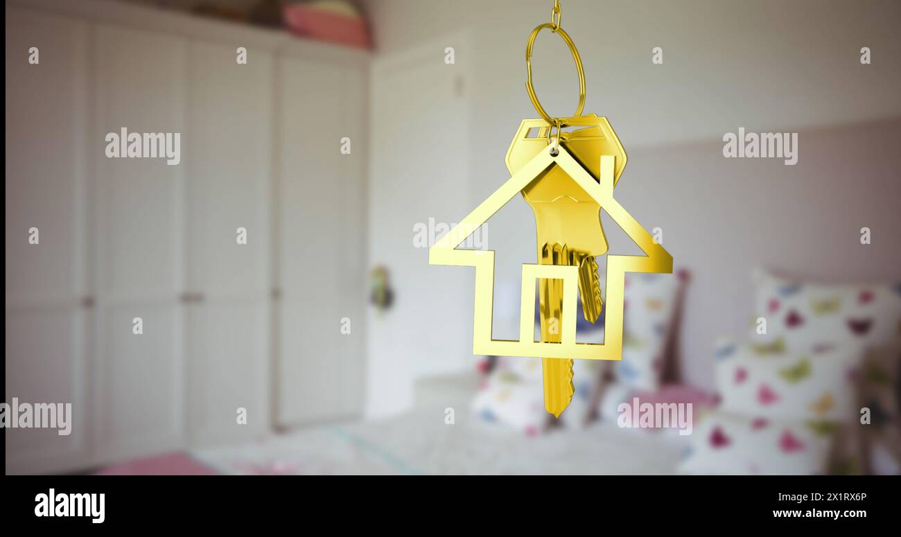 A golden house-shaped keychain hanging in focus with blurred bedroom background Stock Photo - Alamy