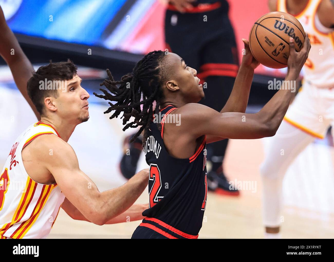 Chicago, USA. 17th Apr, 2024. Ayo Dosunmu (R) of Chicago Bulls goes for ...