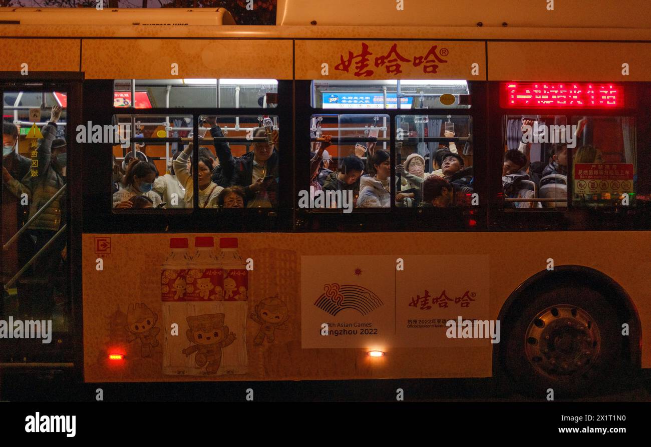 People travel on a local bus in Hangzhou, Zhejiang Province, China ...