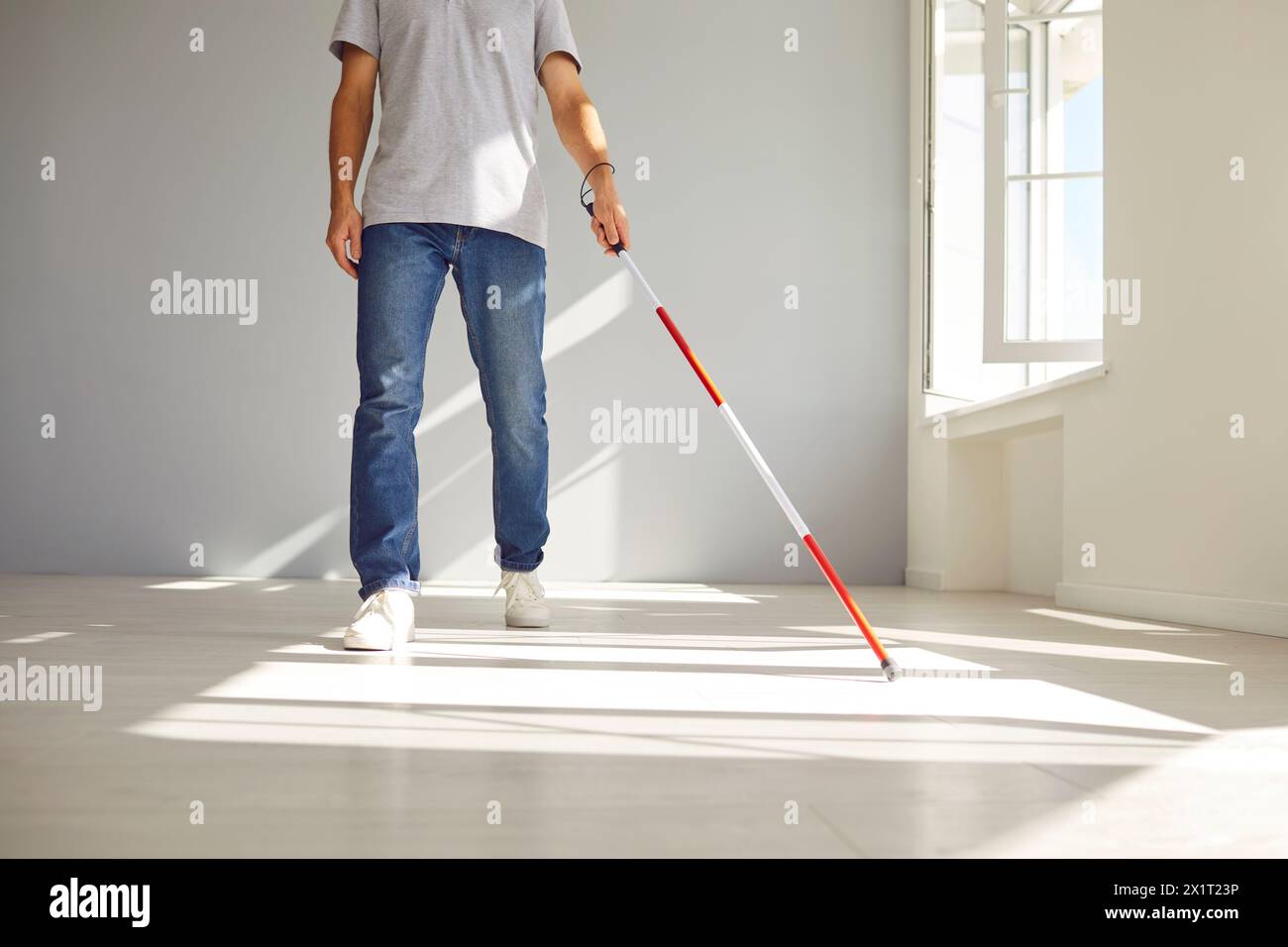 Blind Man Walking at Home using Walking Stick Stock Photo - Alamy