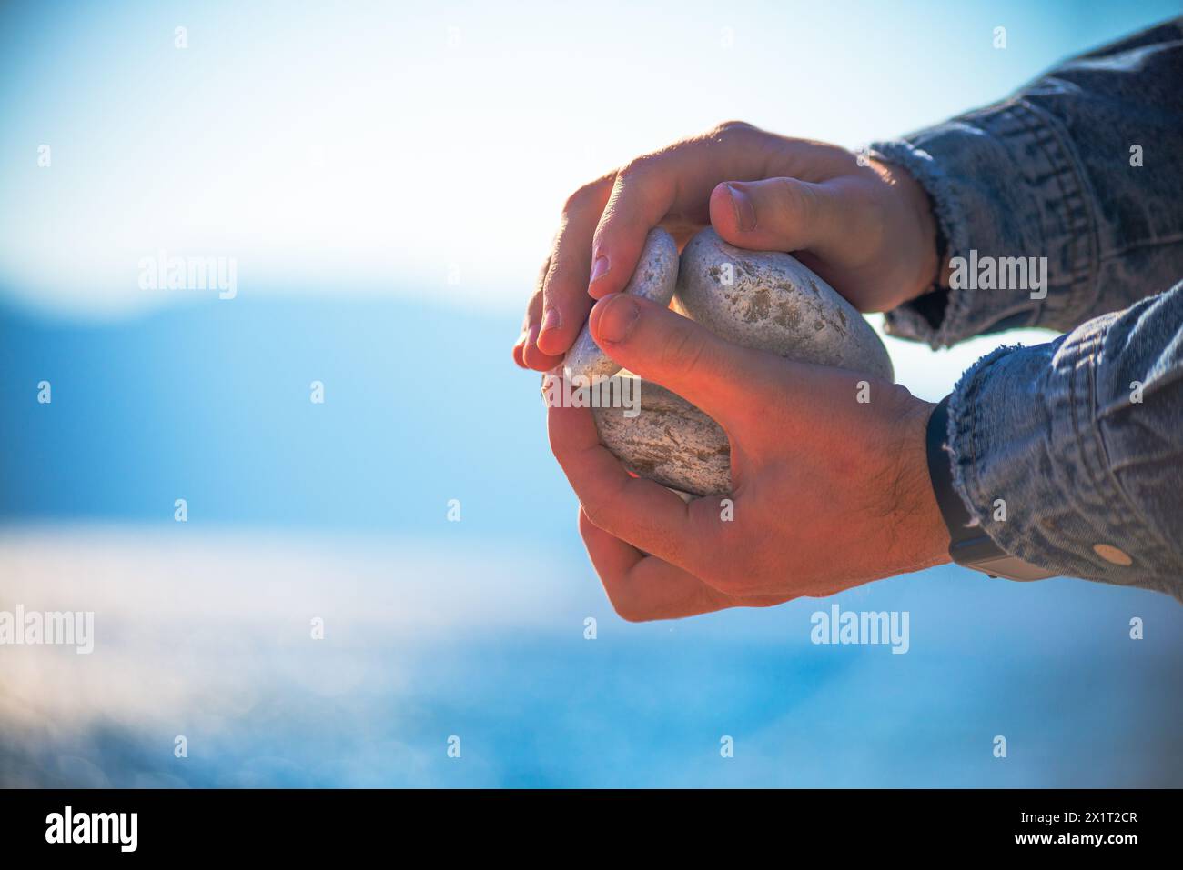 Experience the tactile connection with nature – rocks in the hands, a ...