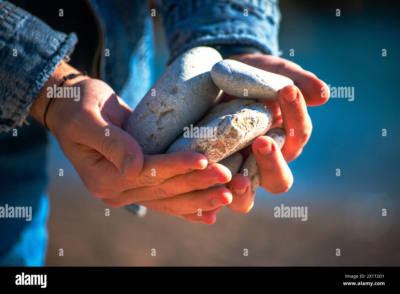 Experience the tactile connection with nature – rocks in the hands, a ...