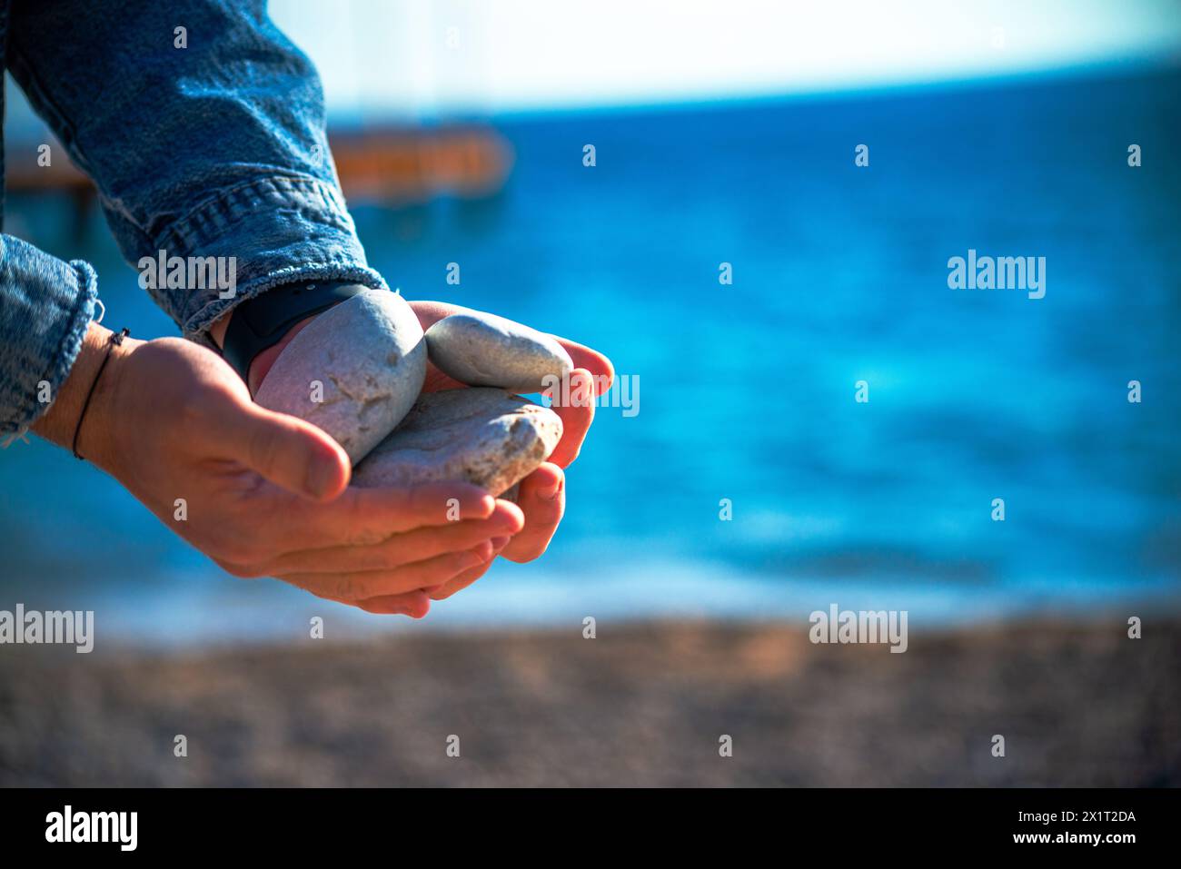 Experience the tactile connection with nature – rocks in the hands, a ...