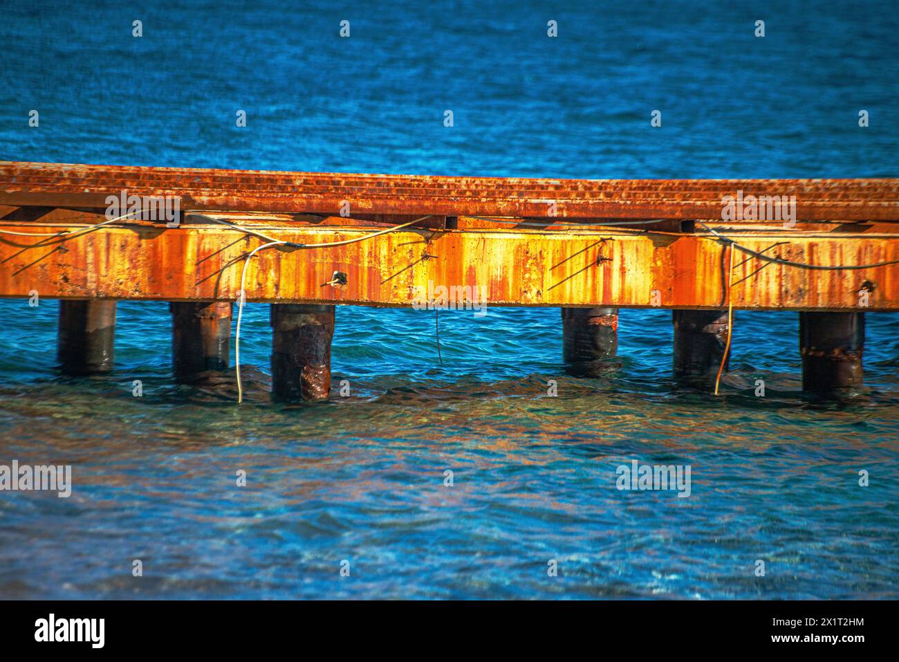 Discover the allure of a weathered, rusty dock standing resilient ...