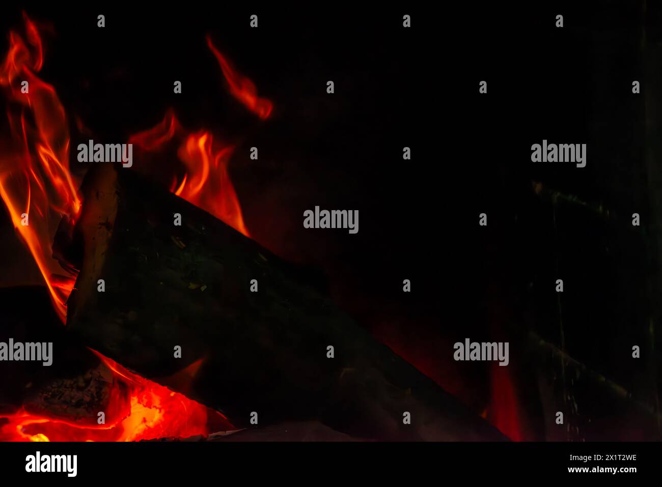 Capture the essence of inferno with a close-up of fiery wood fire ...