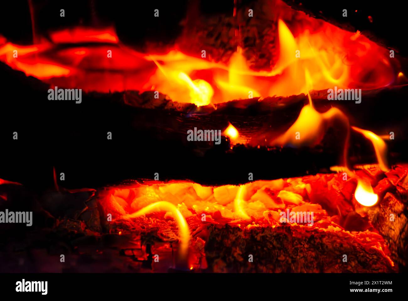 Capture the essence of inferno with a close-up of fiery wood fire ...