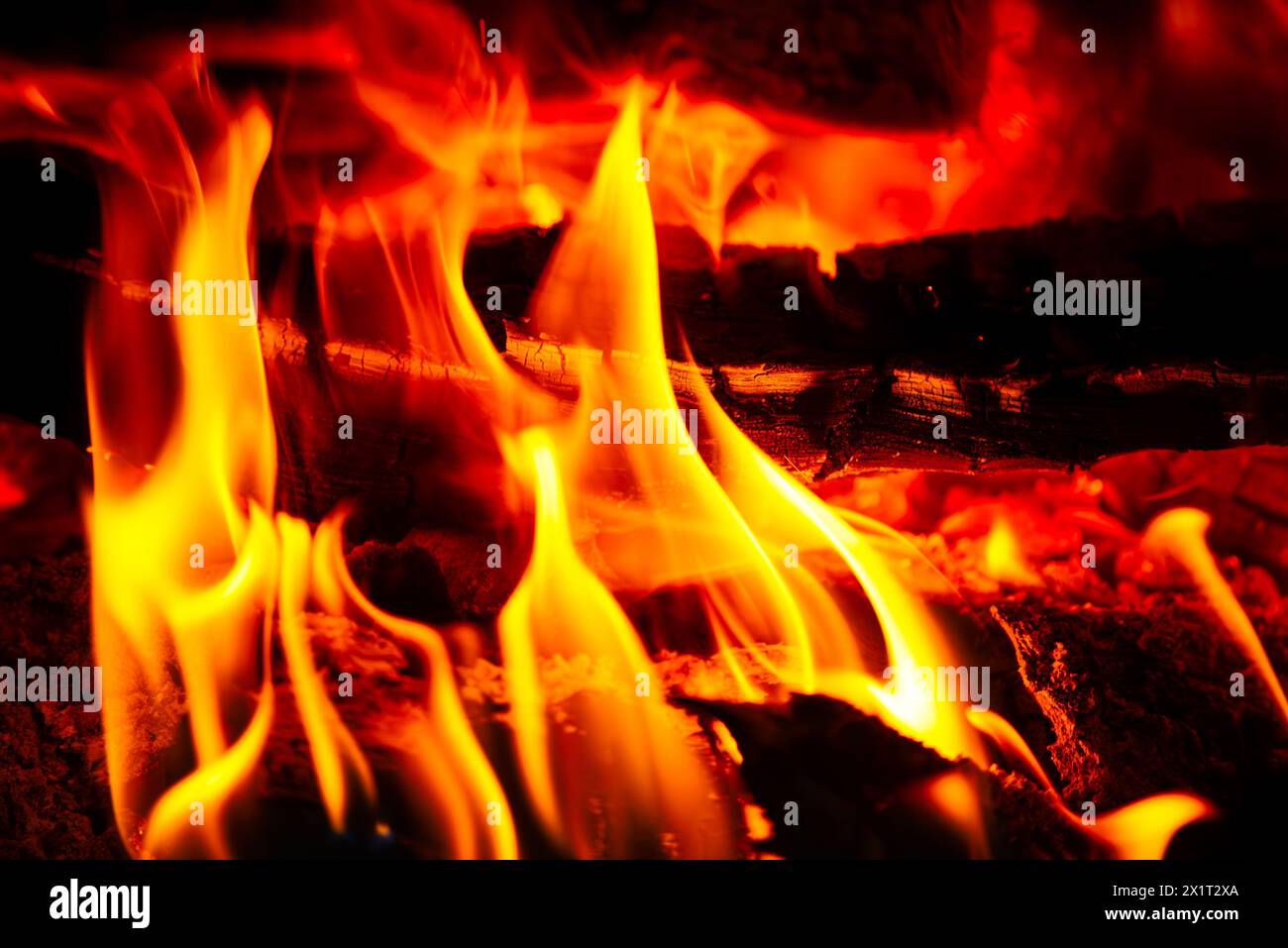 Capture the essence of inferno with a close-up of fiery wood fire ...