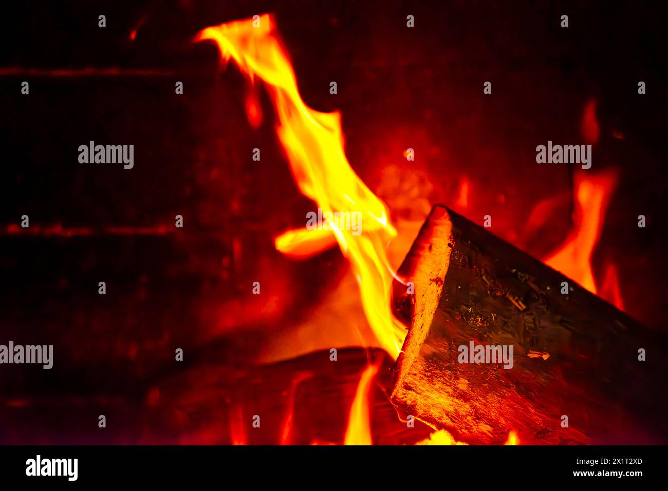 Capture the essence of inferno with a close-up of fiery wood fire ...