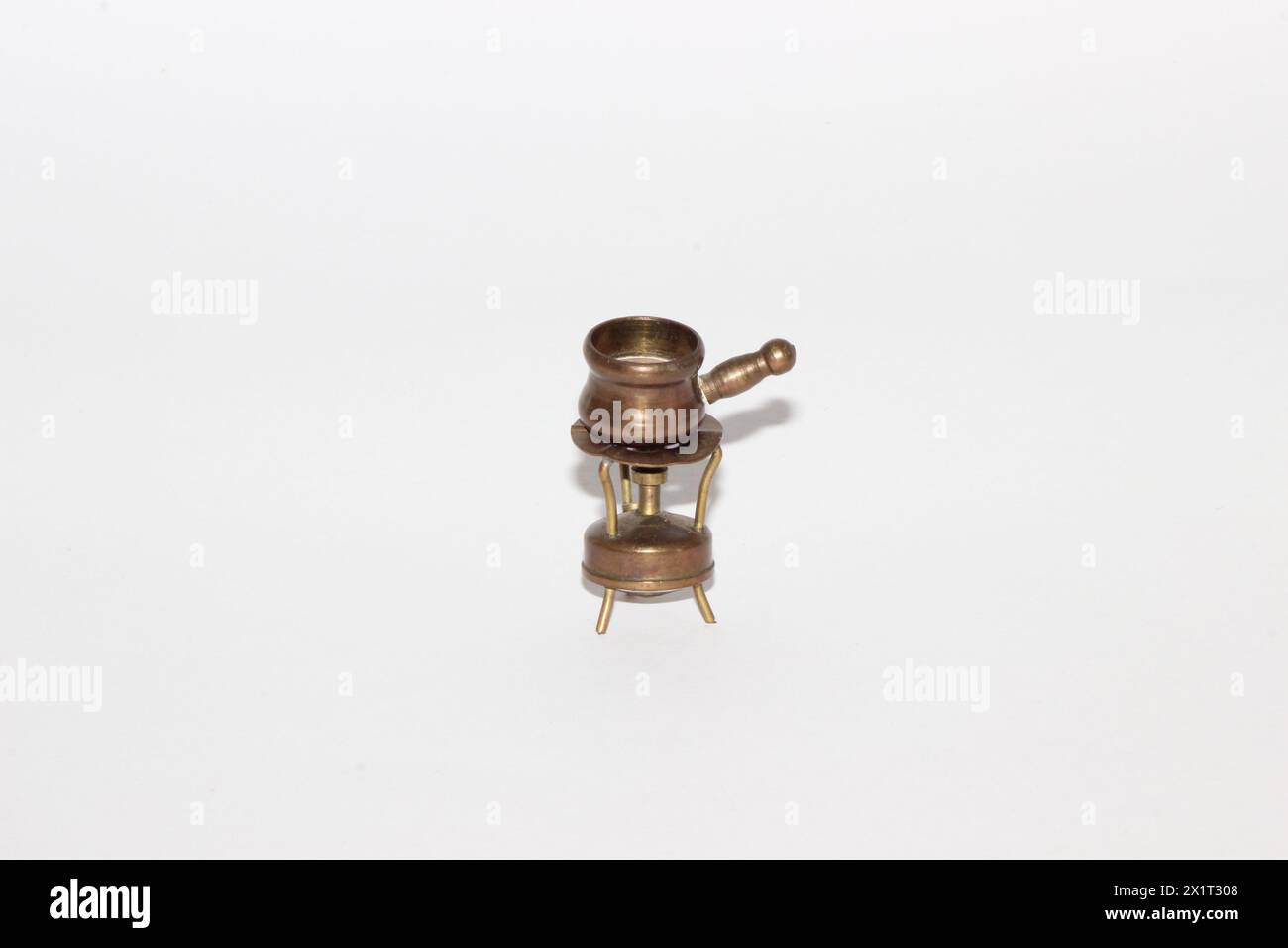 a miniature Vintage Copper Fondue Pot Set on a mini burner Stock Photo ...