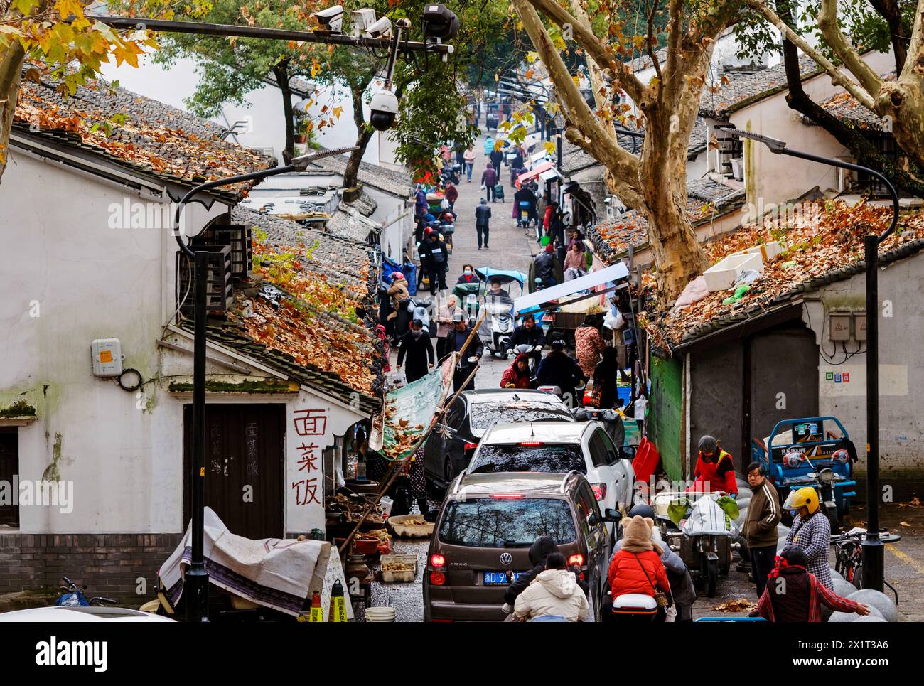 People at a street market near Fushan Park in Shaoxing, Zhejiang ...