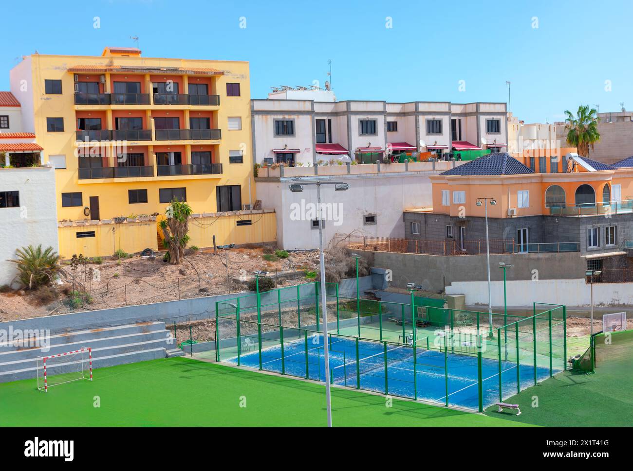 View of the tennis court in residential district. Sport playground in ...