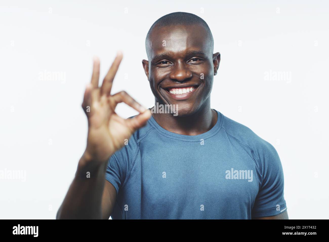 Okay sign, exercise and portrait of black man on a white background for ...