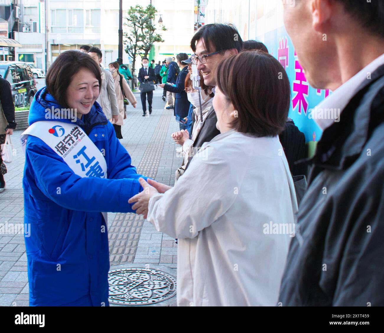 The Conservative Party of Japan, Akari iiyama shakes hands with her ...