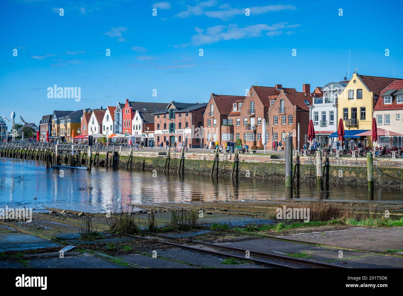 Husum harbor district during autumn with clear sky and lots of tourist ...