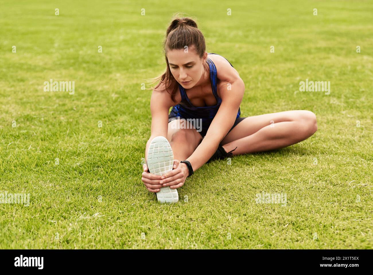Athlete, stretch and legs for woman in nature, grass and exercise for ...