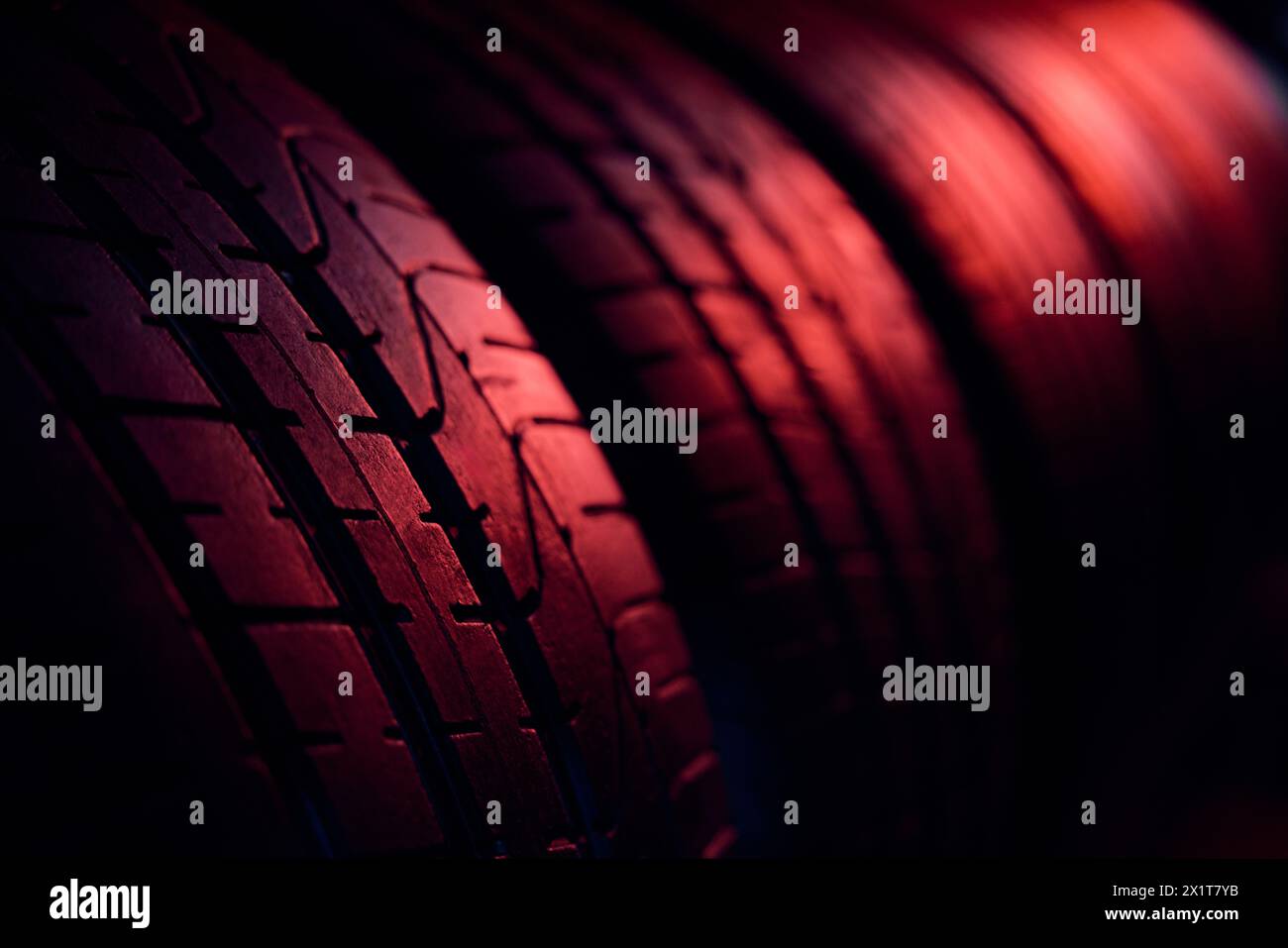 Summer car tires background with red light Stock Photo - Alamy