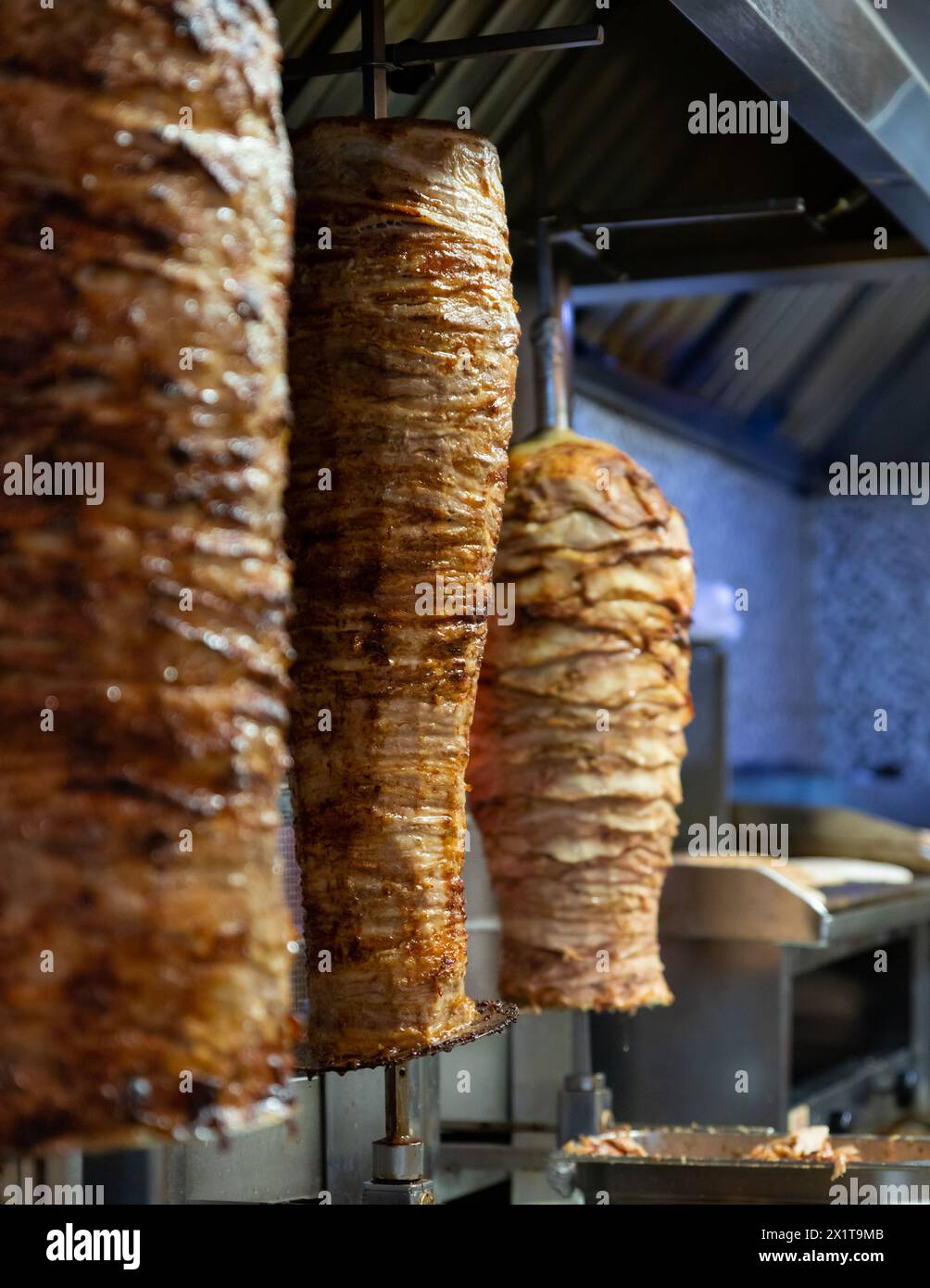 Greek gyros being cooked at the fast food restaurant. Traditional greek ...