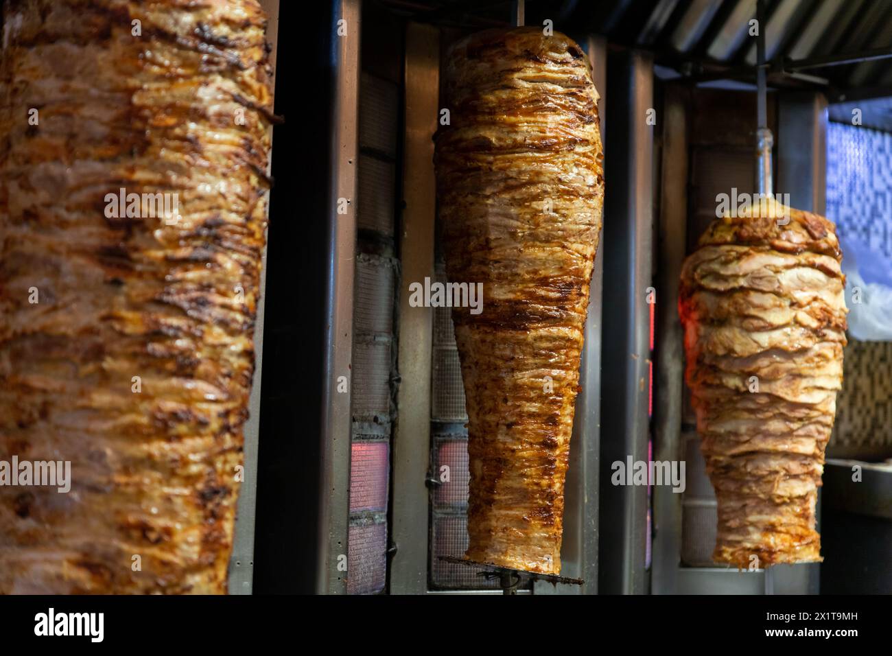 Greek gyros being cooked at the fast food restaurant. Traditional greek ...