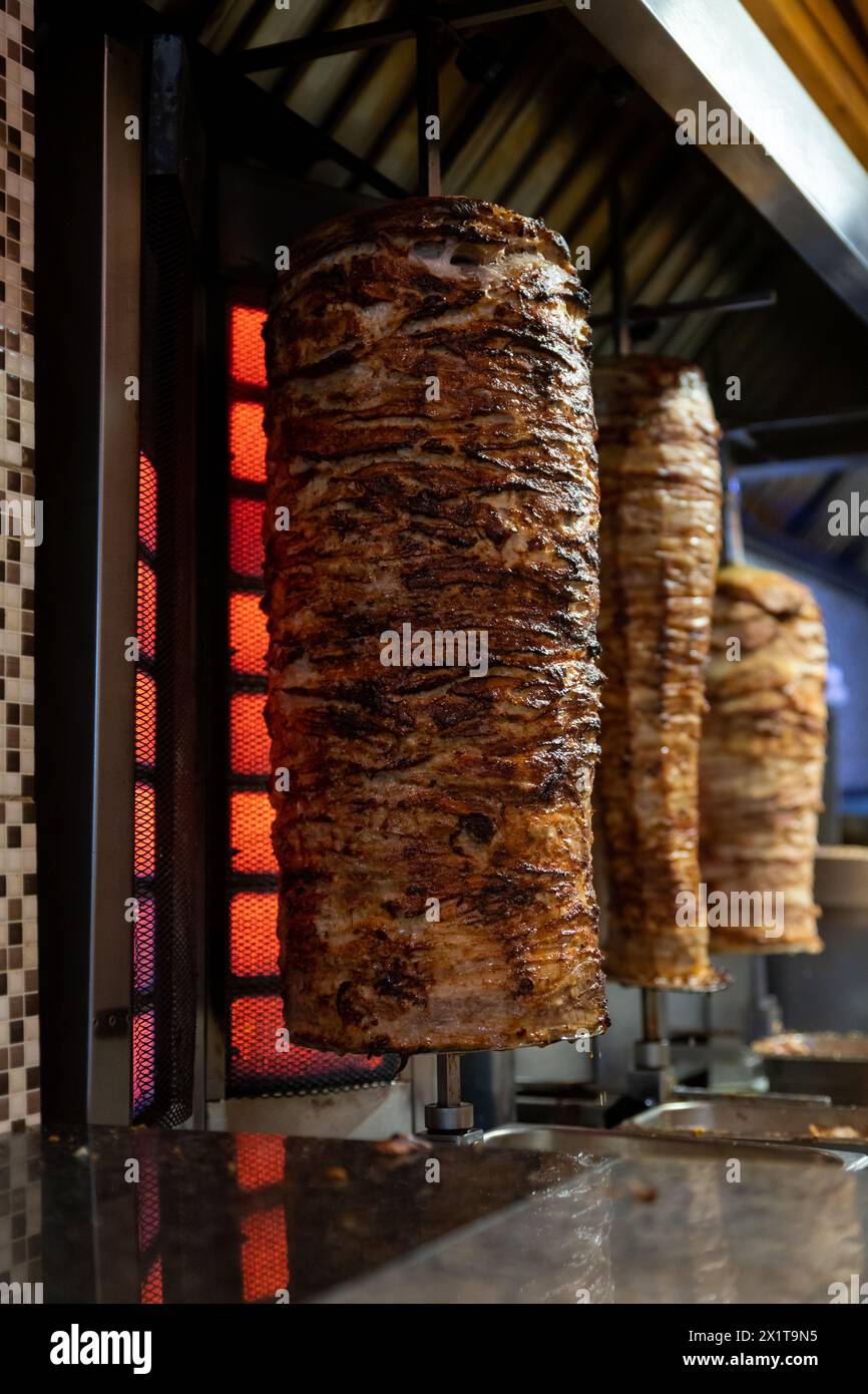 Greek gyros being cooked at the fast food restaurant. Traditional greek ...