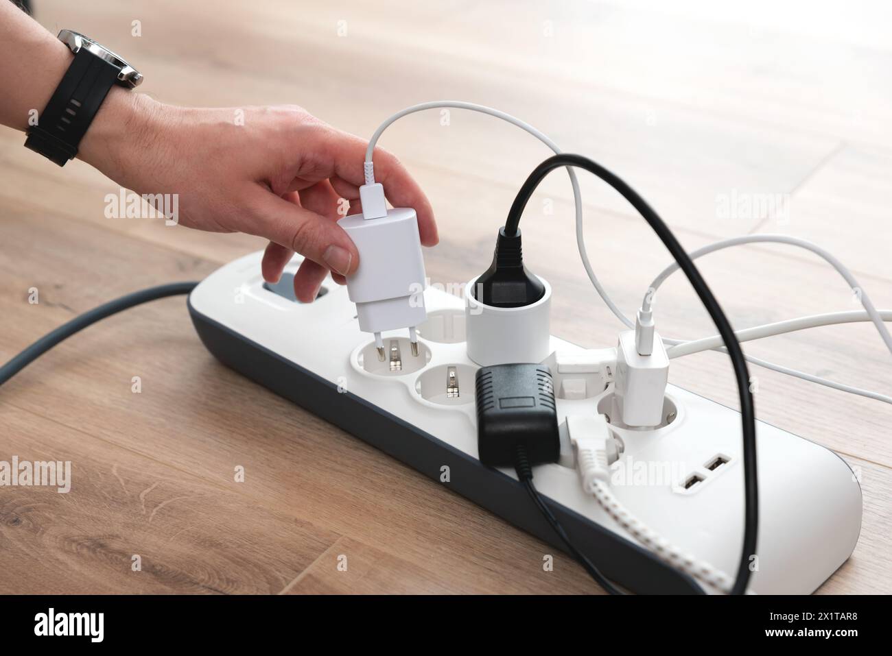 Man plugging in power hi-res stock photography and images - Alamy