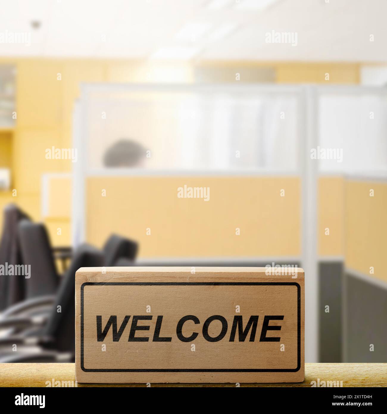 Wooden block with welcome text with workplace background. Introduction ...