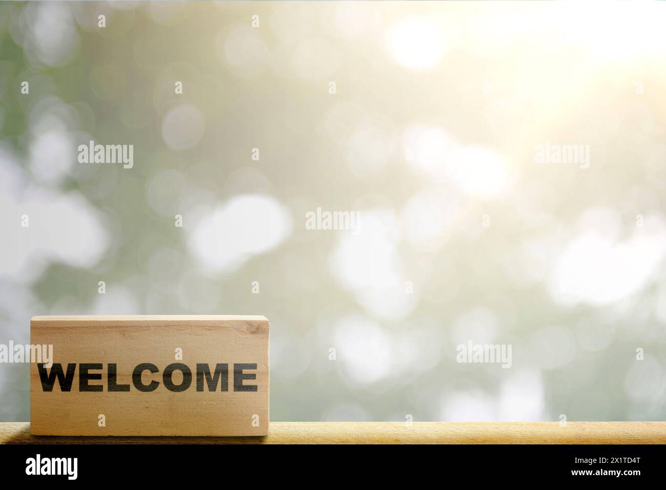 Wooden block with welcome text with blurred background. Introduction ...