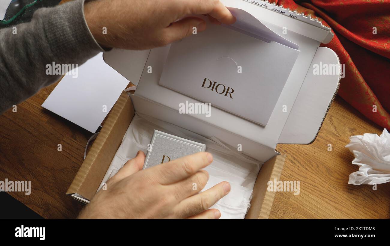Paris, France - Sep 14, 2023: Male hands handling a sophisticated Dior ...