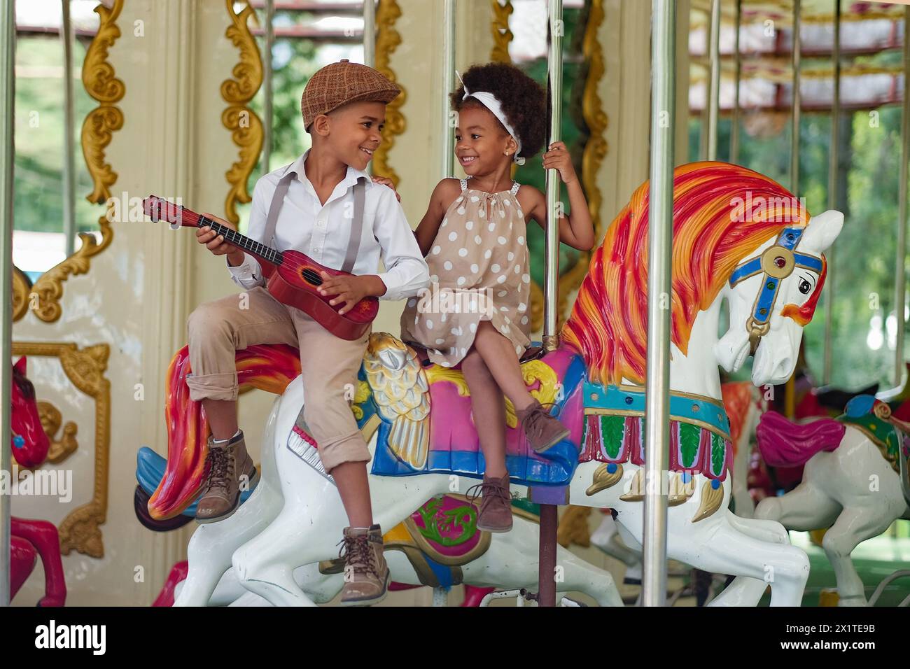 Child boy on carousel hi-res stock photography and images - Alamy