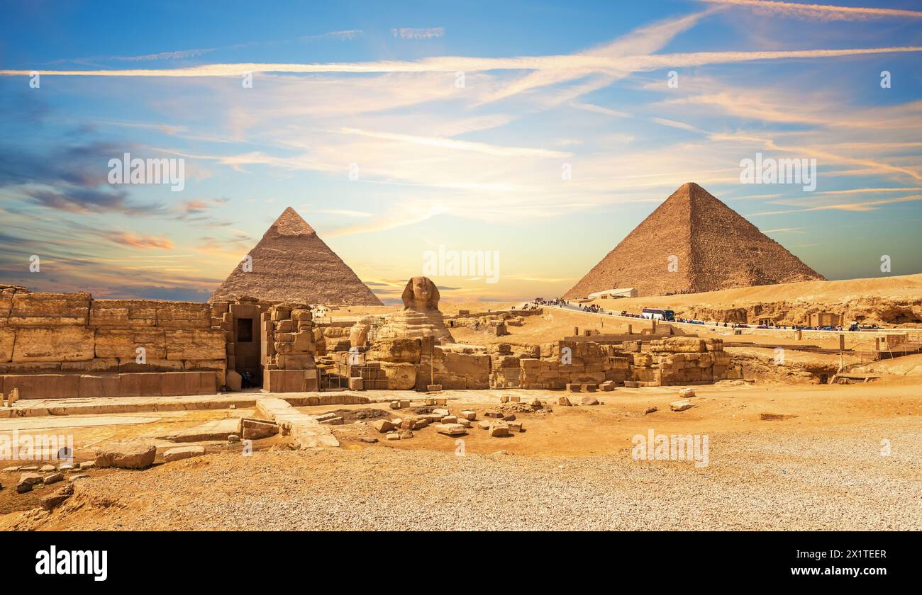 The Great Sphinx next to the Pyramids of Egypt at sunset, Giza desert ...