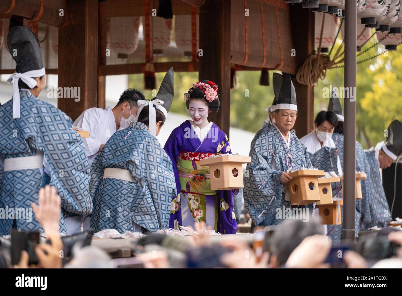 Yasaka Shrine Setsubun festival roasted beans scattering ceremony "mamemaki". Maiko throwing the ...