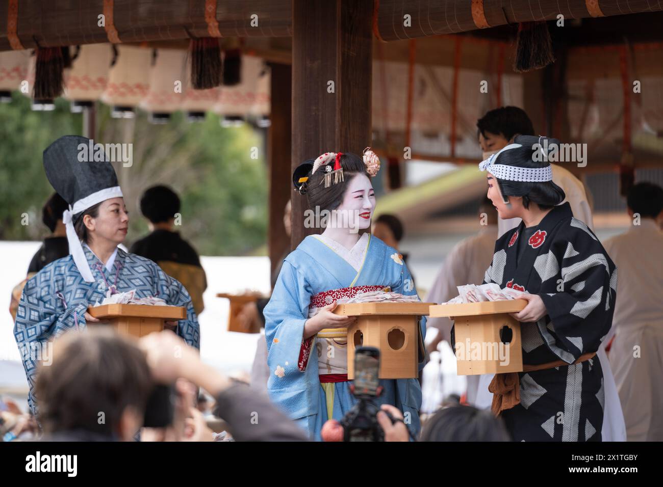 Yasaka Shrine Setsubun festival roasted beans scattering ceremony "mamemaki". Maiko throwing the ...