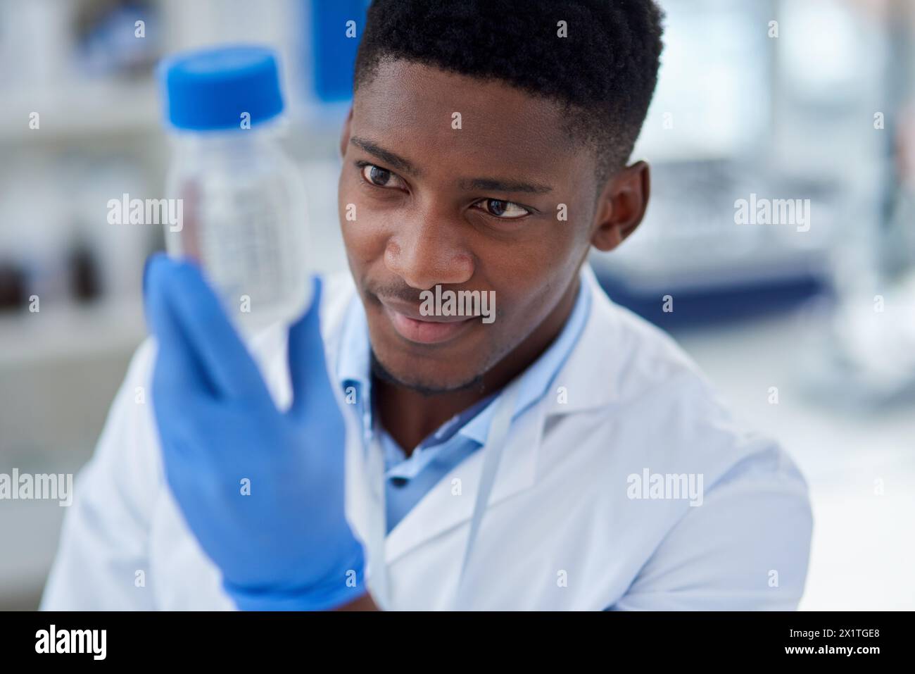 Science, research and black man with container, chemical or medical ...