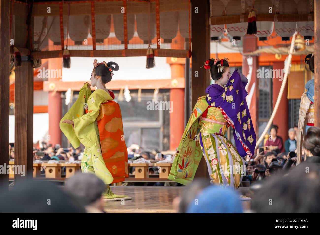 Kyoto, Japan - February 2 2024 : Maikos are dancing traditional Japanese dance in Yasaka Shrine ...