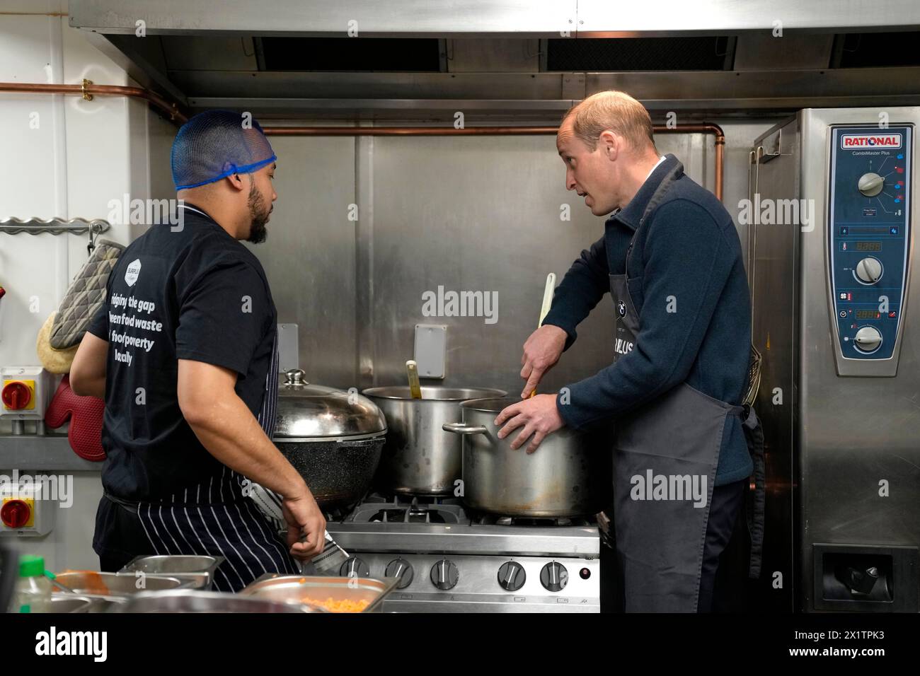 The Prince of Wales (right) helps make bolognase sauce with head chef ...