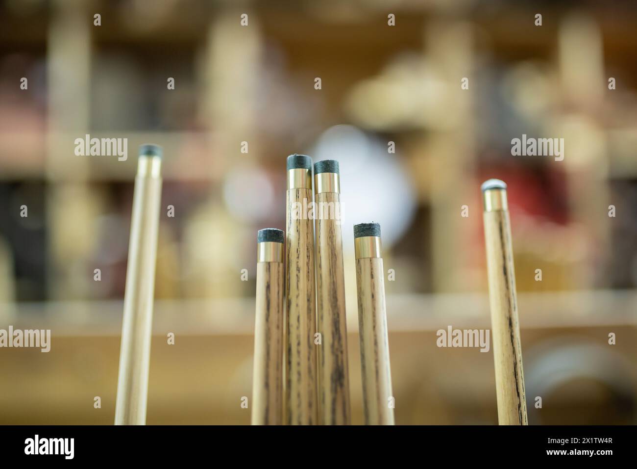 Snooker cues showing the tips in a workshop Stock Photo - Alamy