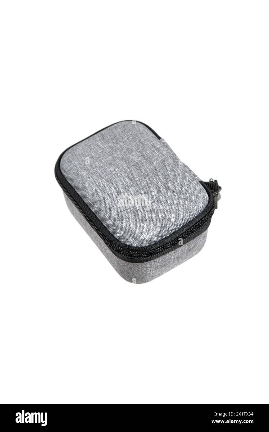 Protective hard case with a zipper and a gray fabric texture. Isolate ...