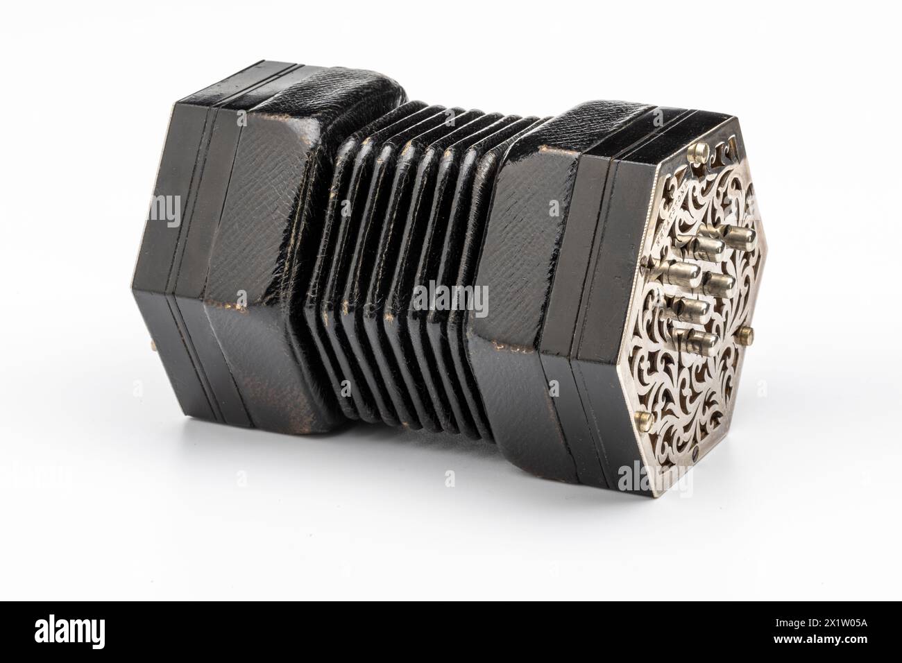 The three quarte side view of a CW Wheatstone miniature Concertina ...