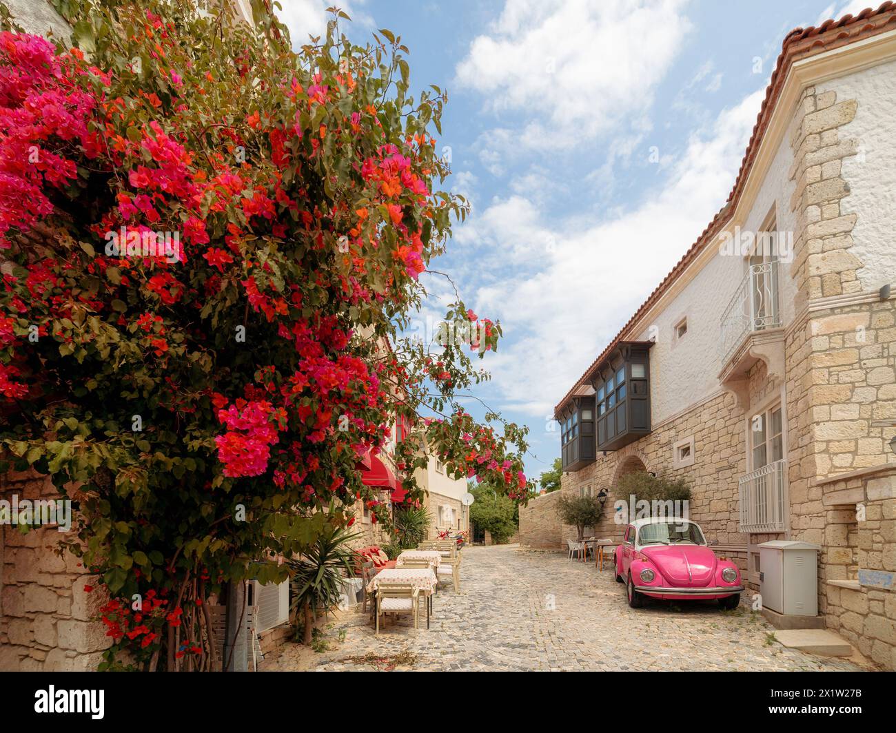 Pink car on a narrow street, Turkey Stock Photo - Alamy
