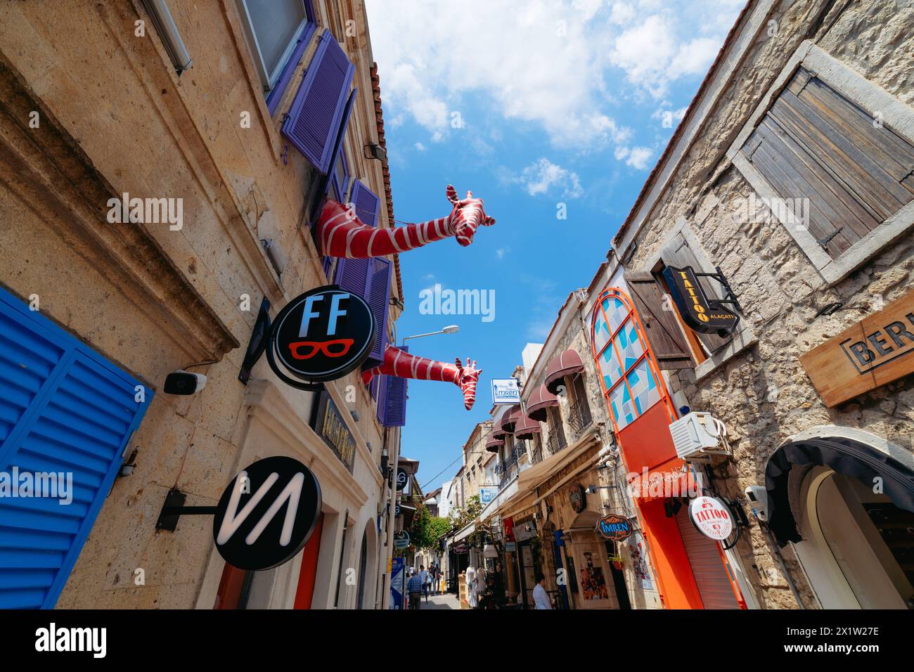 A giraffe figures hangs from a building facade, Turkey Stock Photo - Alamy