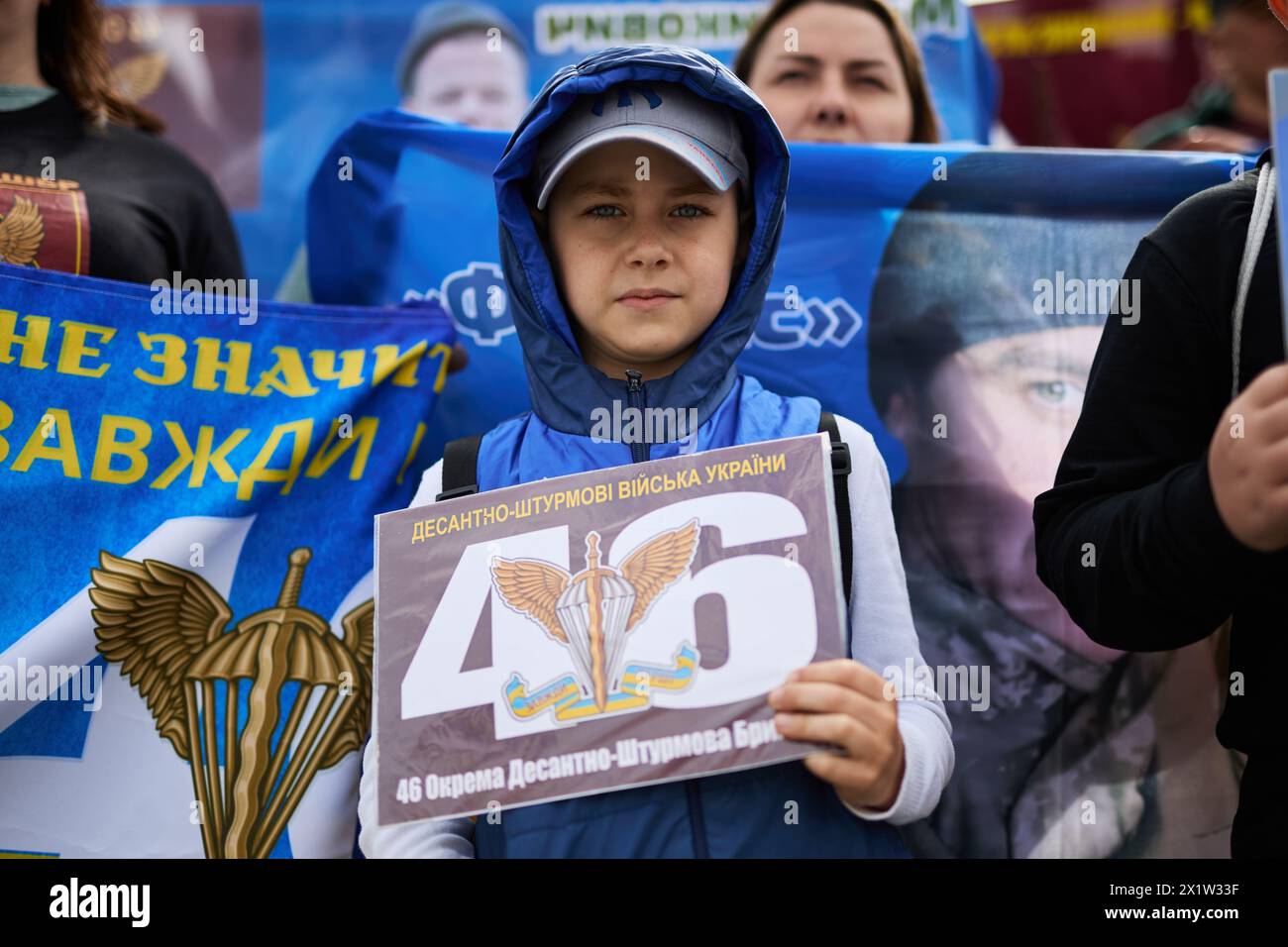Little Ukrainian girl posing with a symbol of the 46th Assault Brigade ...