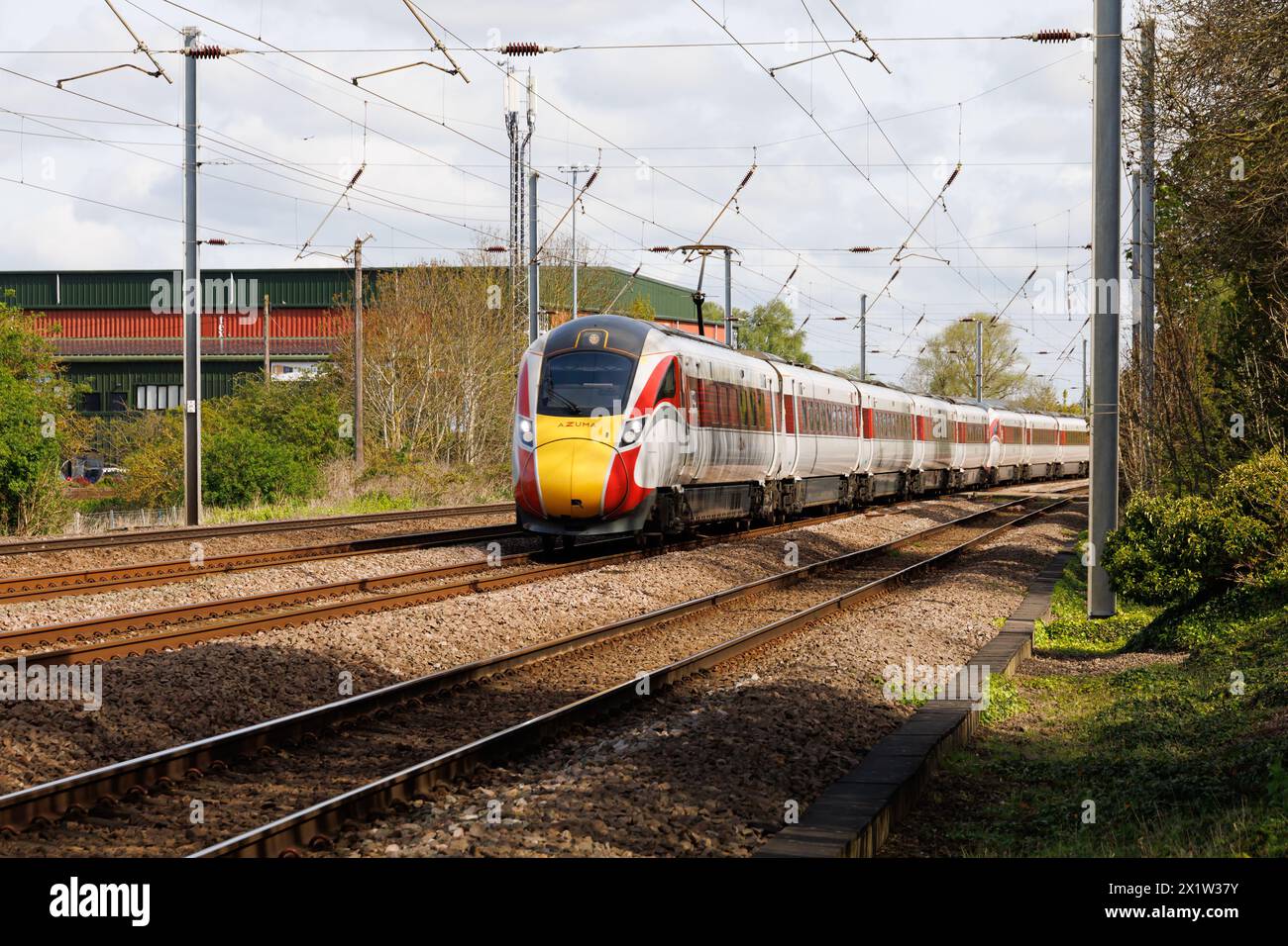 London North Eastern Railway, LNER, Azuma hybrid diesel electric passenger train speeding ...