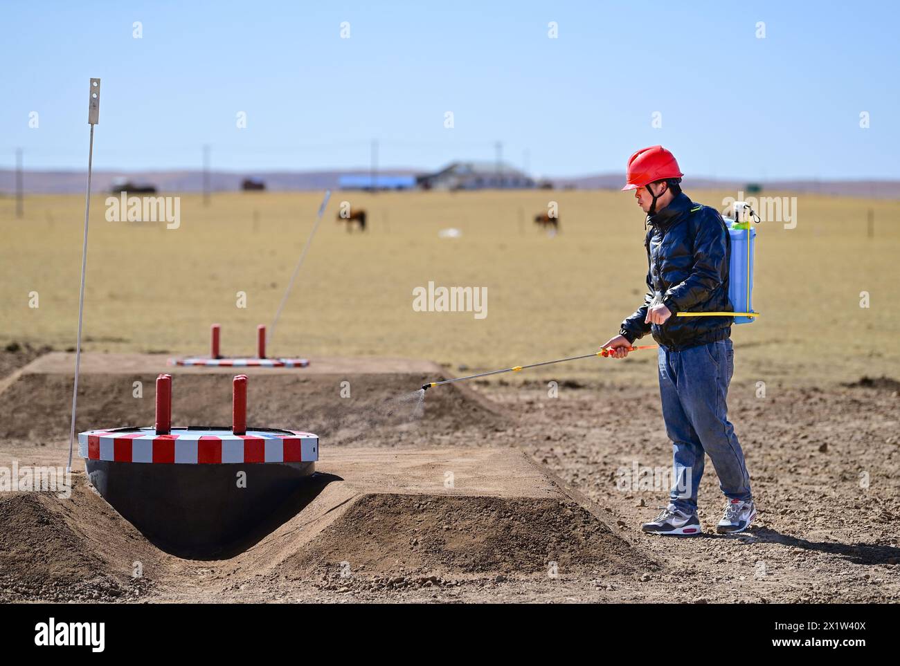 XILINGOL, CHINA - APRIL 18, 2024 - A builder maintains the base of a ...