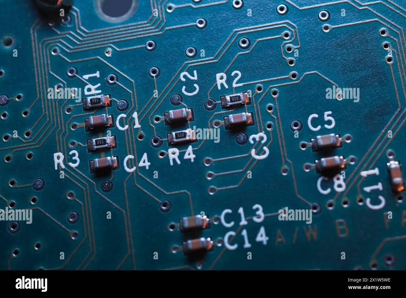 Close-up of blue lighted electronic computer circuit board with microchips and lines, Studio ...