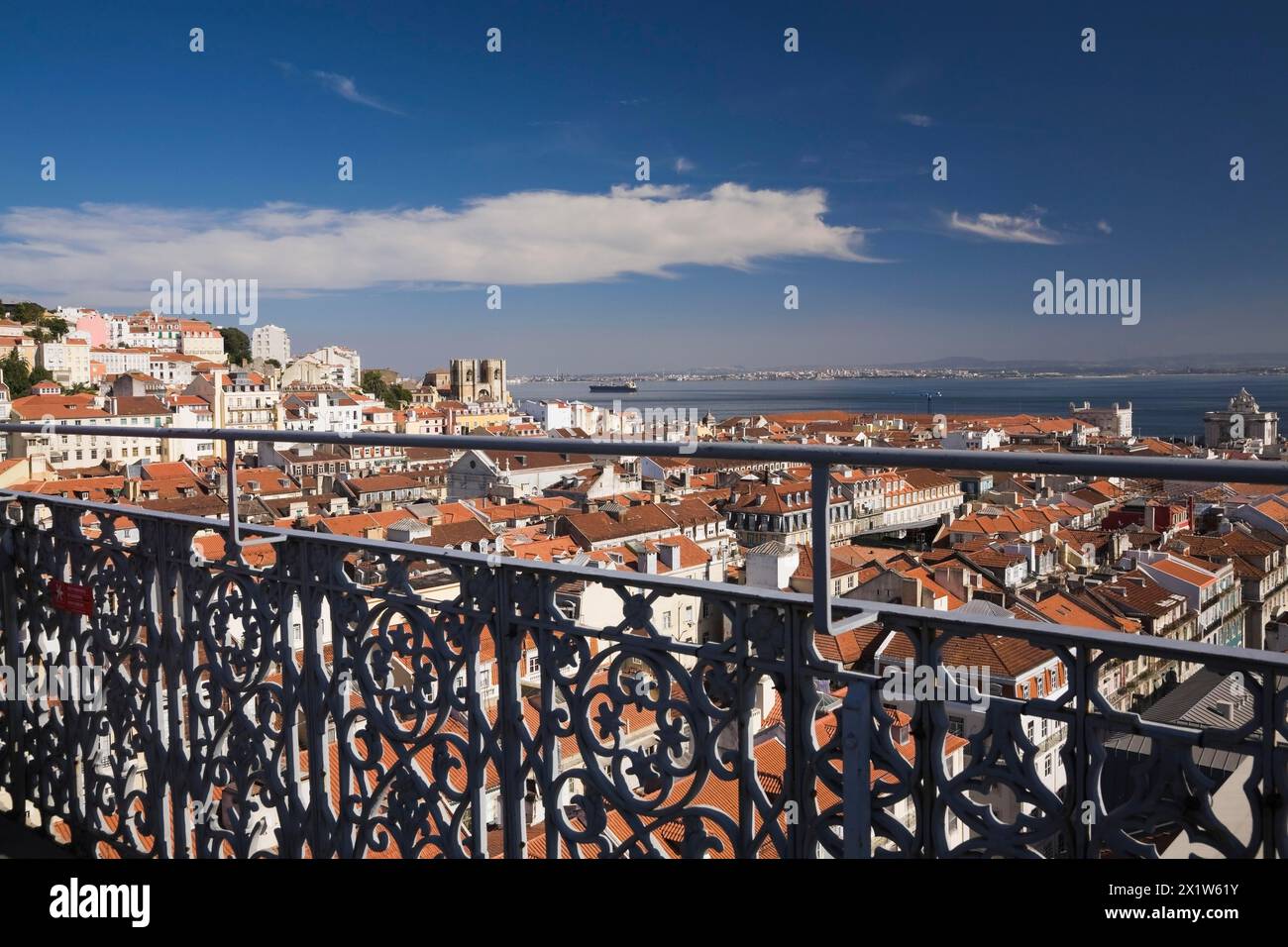 Grey wrought iron railing and high angle view of buildings with ...
